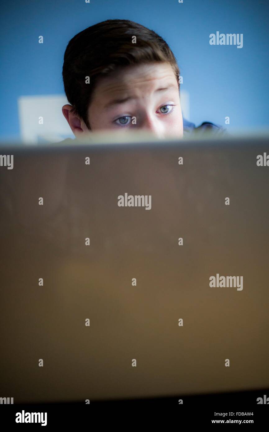 MODEL RELEASED. Boy using a laptop computer Stock Photo - Alamy