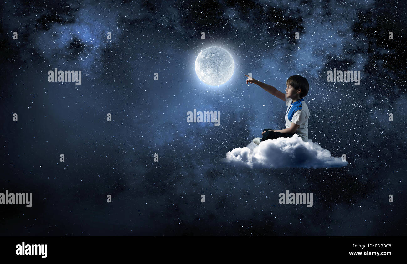 Cute school boy sitting on cloud and touching moon with finger Stock ...