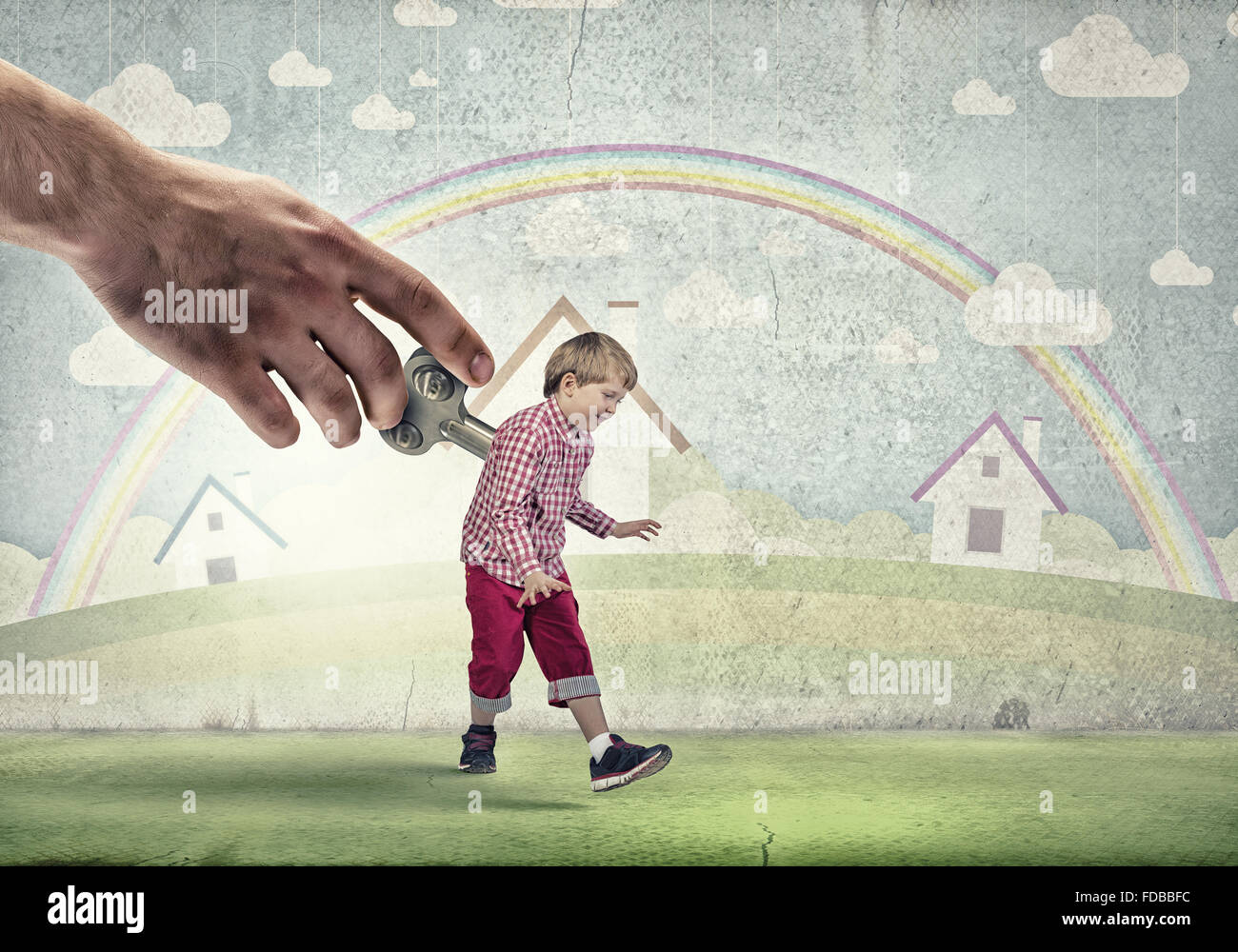 Little cute active boy with key on back Stock Photo - Alamy