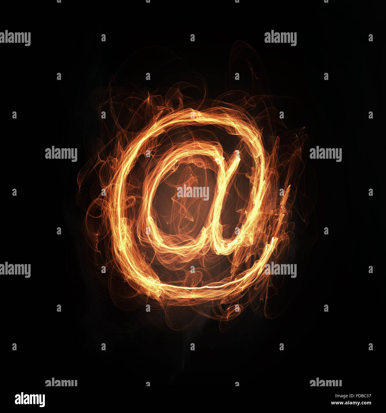 Glowing light email symbol on dark background Stock Photo - Alamy