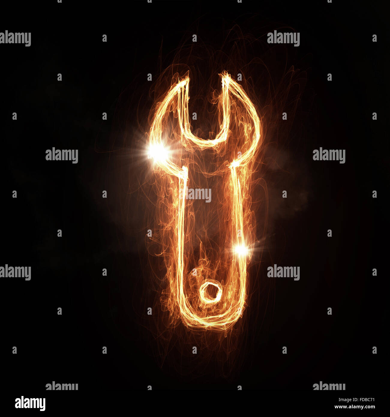 Fire wrench glowing icon on dark background Stock Photo - Alamy