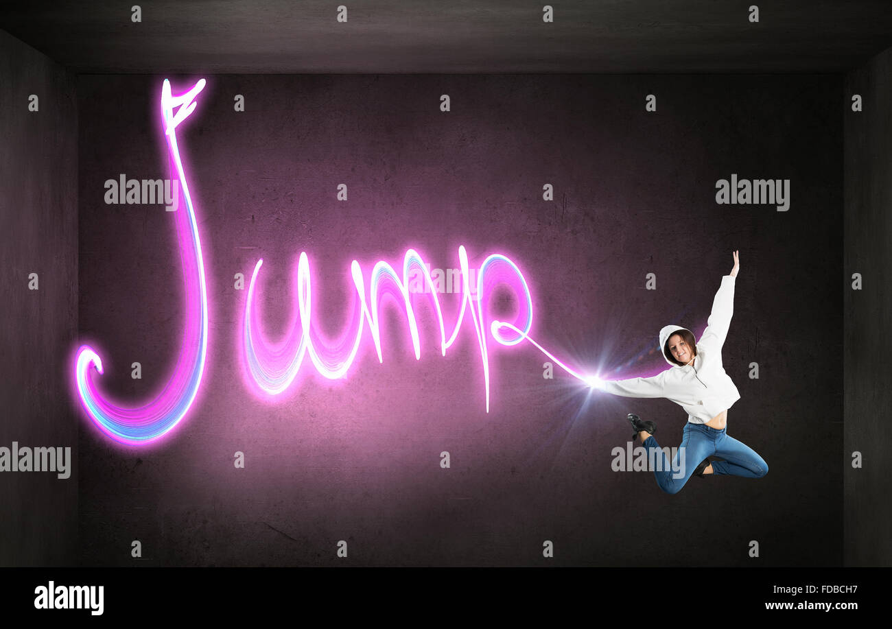 Young girl jumping high in sky and drawing dance concept Stock Photo ...