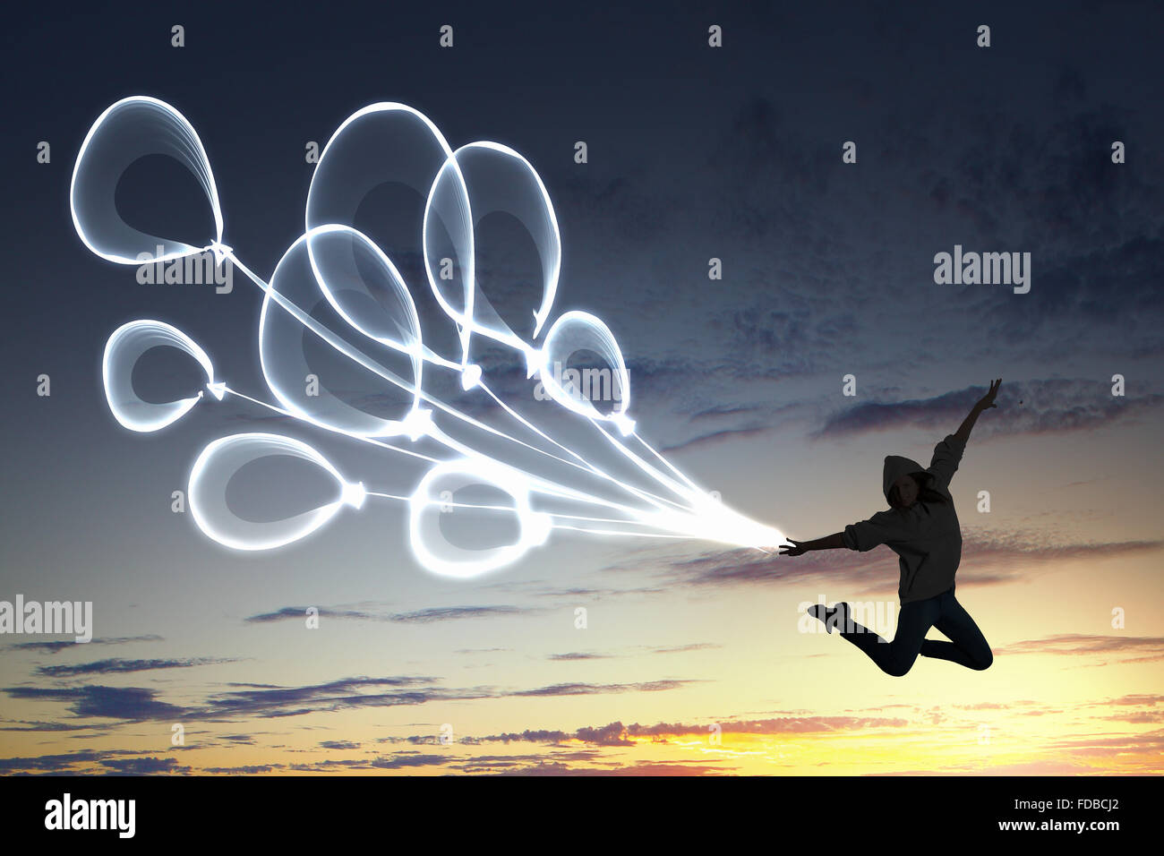 Young girl jumping high in sky representing happiness concept Stock ...
