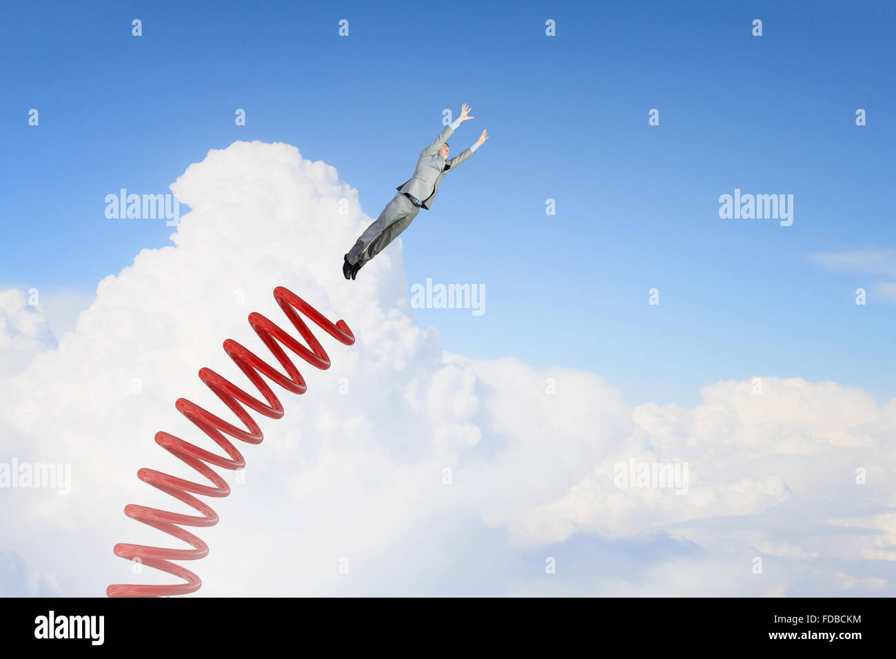 Businessman jumping on springboard as progress concept Stock Photo - Alamy