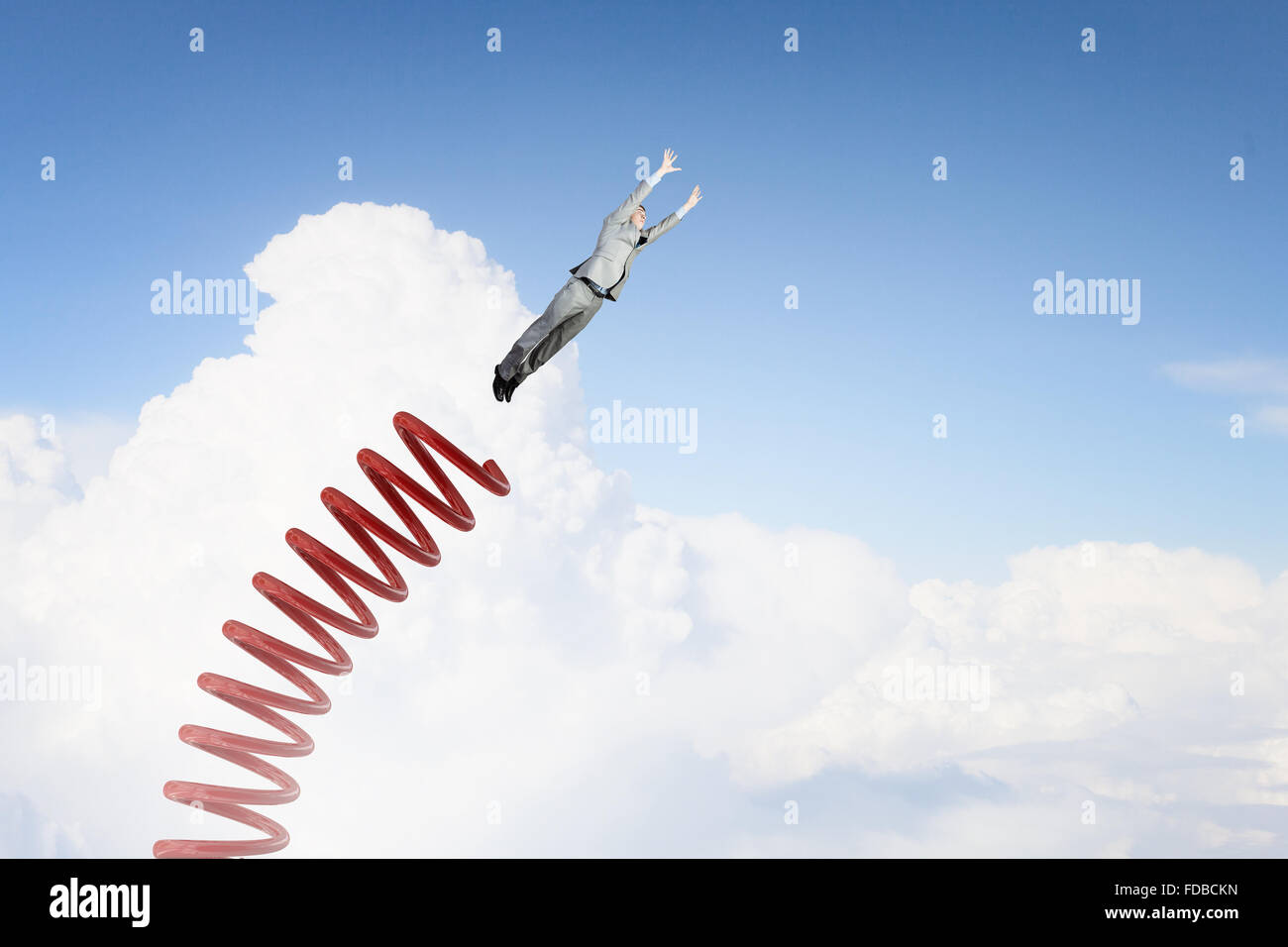 Businessman jumping on springboard as progress concept Stock Photo - Alamy