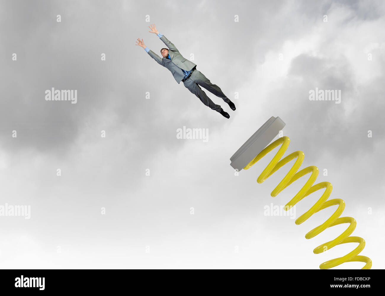 Businessman jumping on springboard as progress concept Stock Photo - Alamy