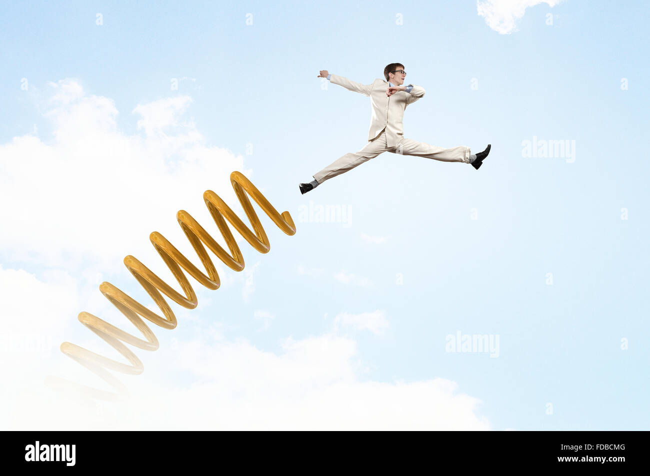 Businessman jumping on springboard as progress concept Stock Photo - Alamy