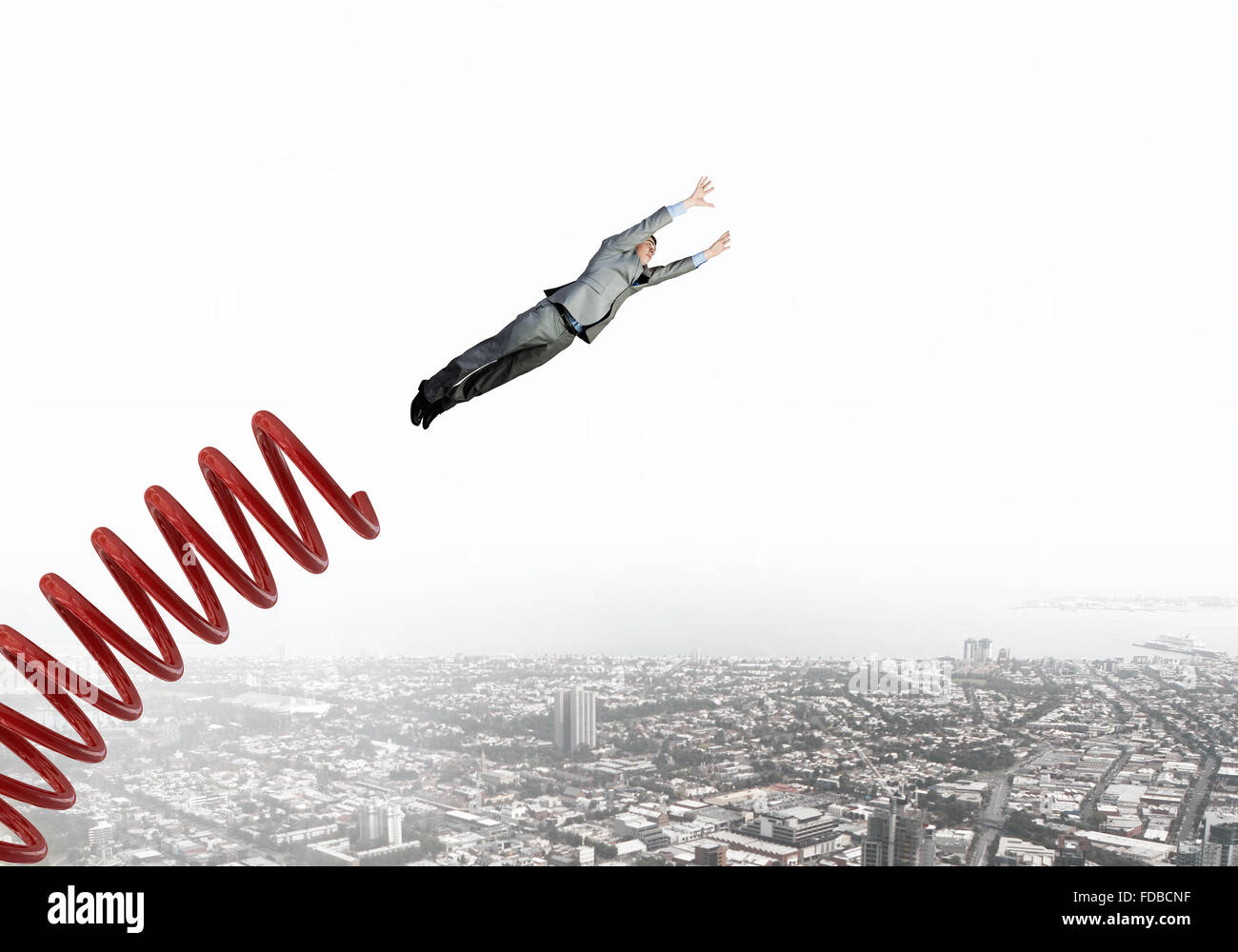 Businessman jumping on springboard as progress concept Stock Photo - Alamy