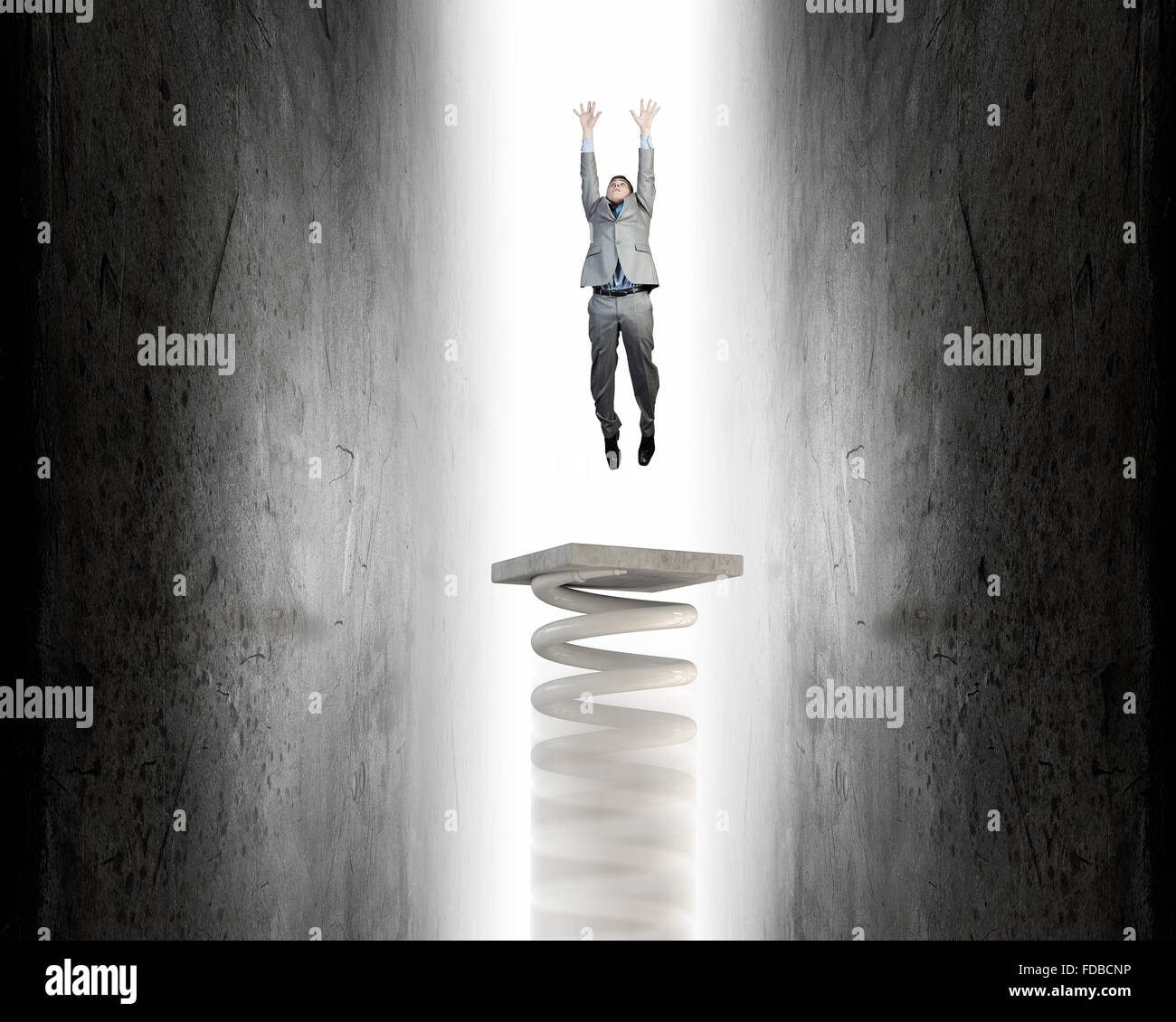 Businessman jumping on springboard as progress concept Stock Photo - Alamy