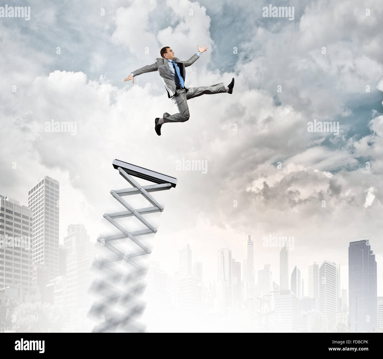 Businessman jumping on springboard as progress concept Stock Photo - Alamy