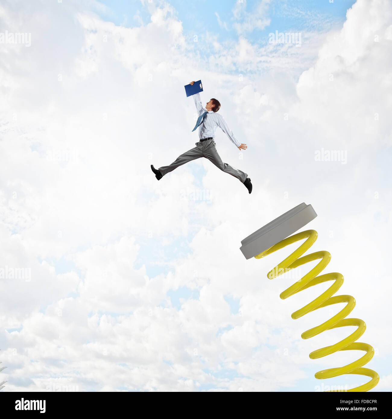 Businessman jumping on springboard as progress concept Stock Photo - Alamy