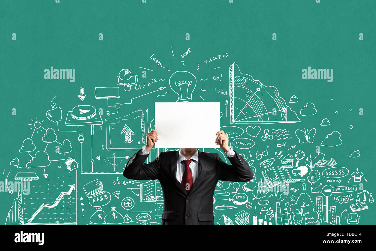 Businessman hiding his face behind paper list Stock Photo - Alamy