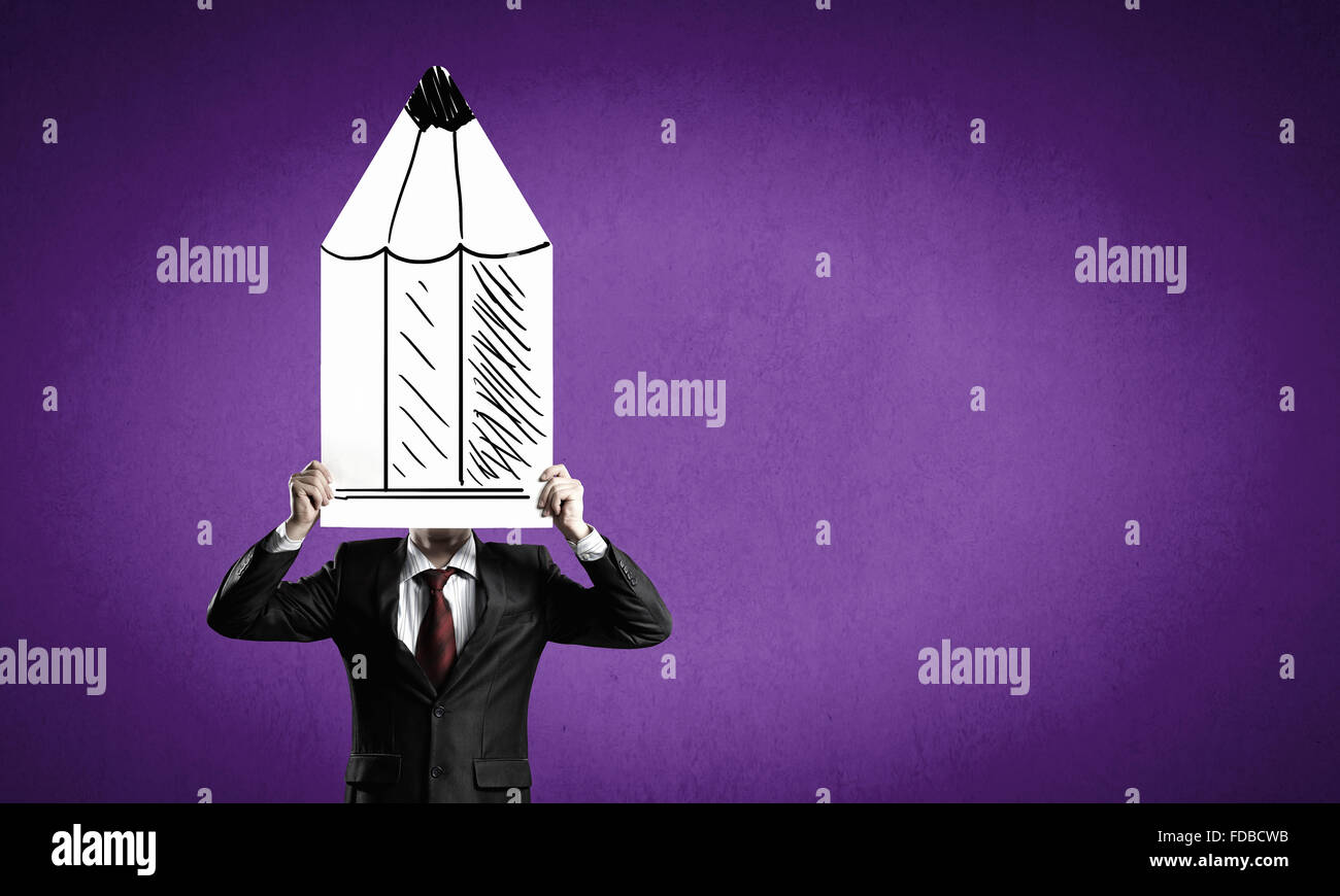 Businessman hiding his face behind pencil paper sheet Stock Photo - Alamy