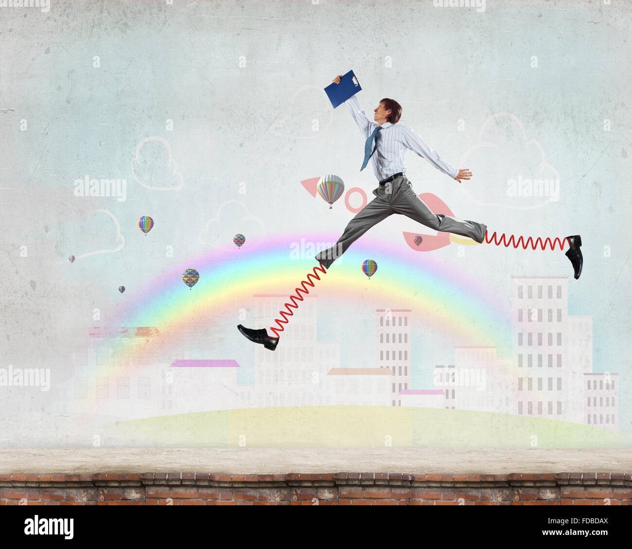 Businessman in suit jumping with big springs on feet Stock Photo - Alamy