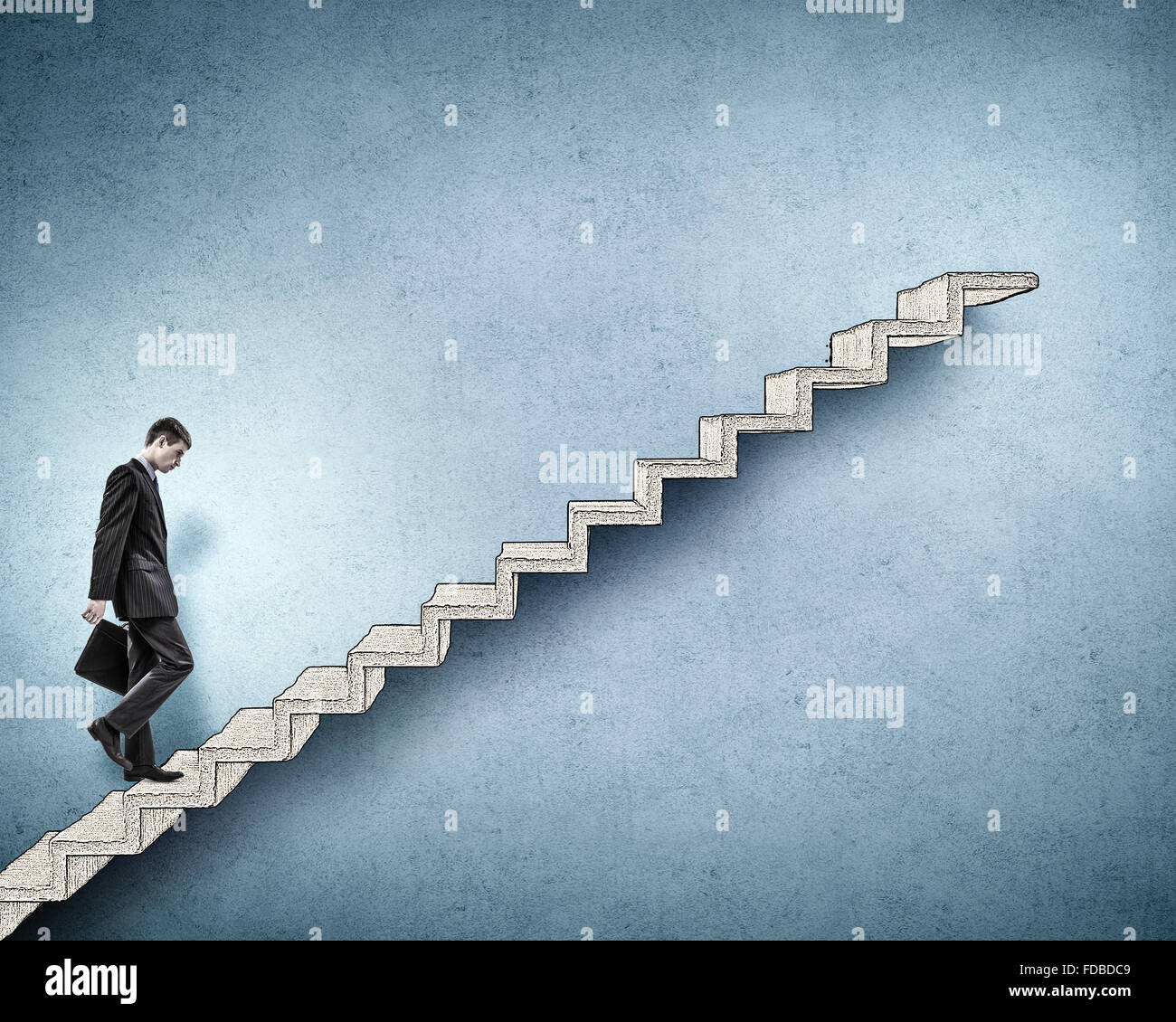 Young businessman walking up on ladder representing success concept ...