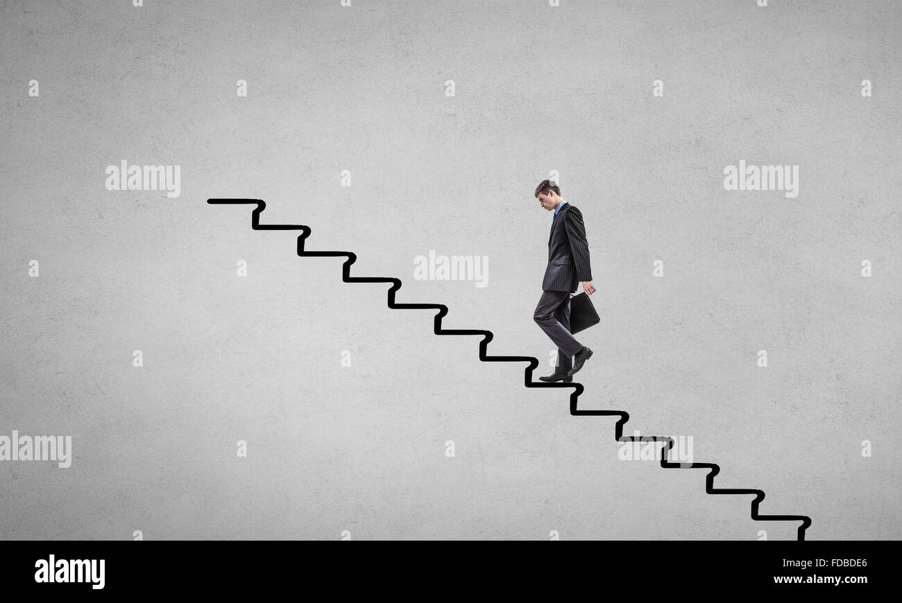 Young businessman walking up on ladder representing success concept ...