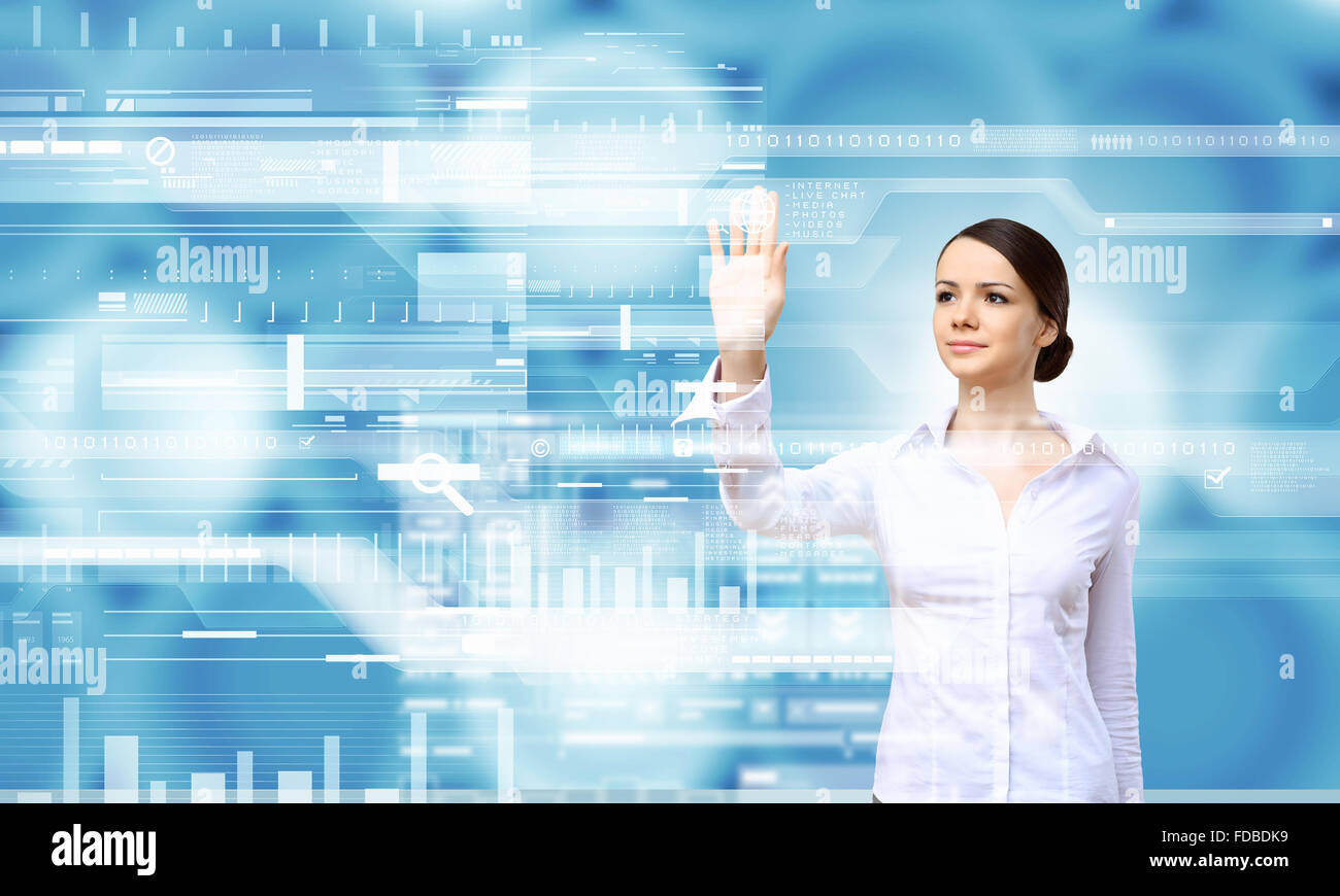 Attractive businesswoman touching with finger virtual interface screen ...