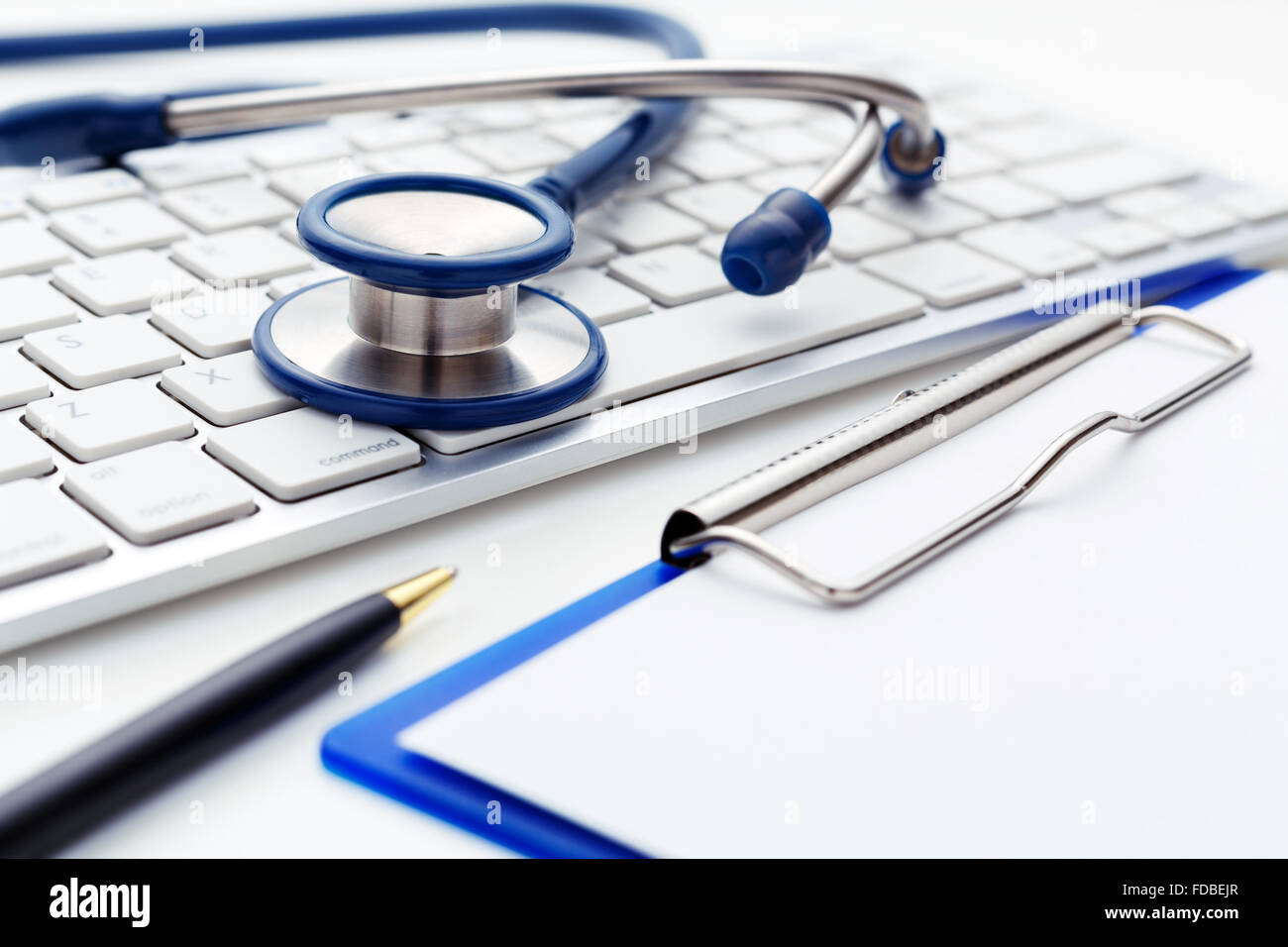 Medical concept with stethoscope on computer keyboard with clipboard ...