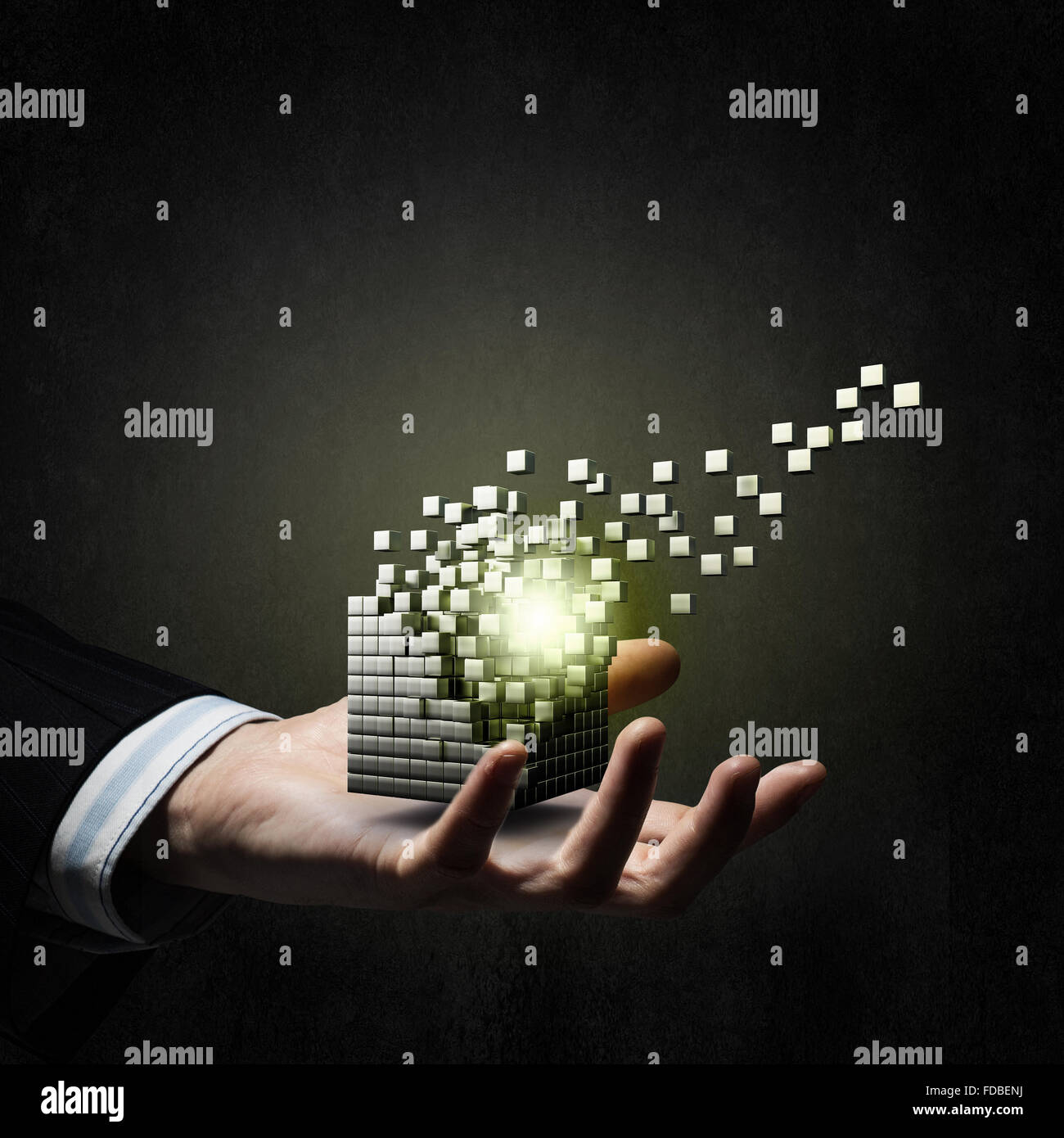 Businessman hand shows disintegrating cube in palm Stock Photo - Alamy