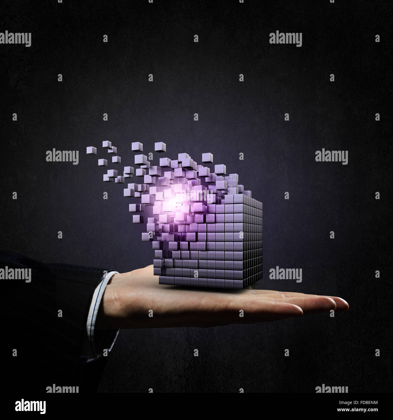 Businessman hand shows disintegrating cube in palm Stock Photo - Alamy
