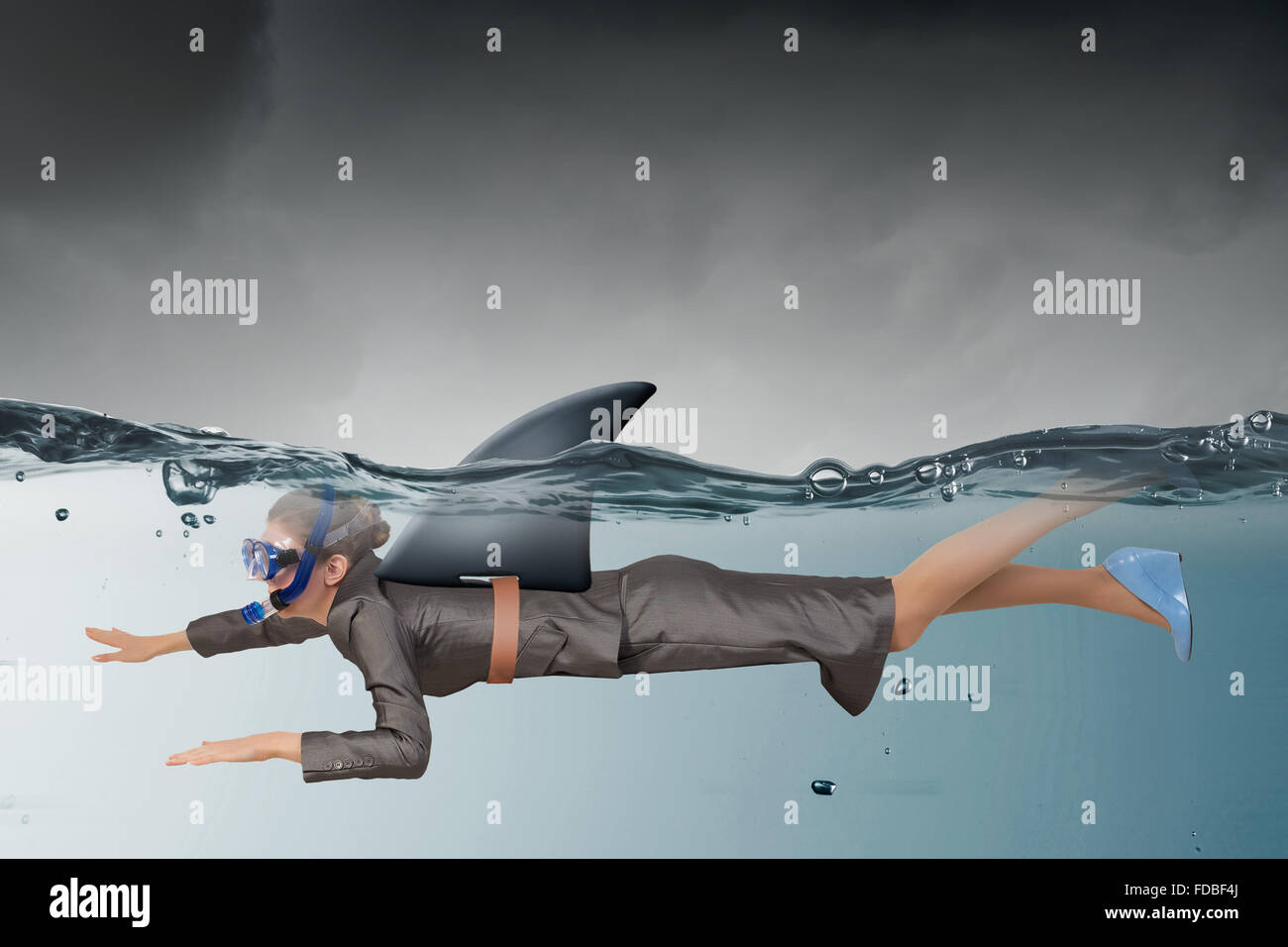 Young businesswoman with shark flipper swiming under water Stock Photo - Alamy