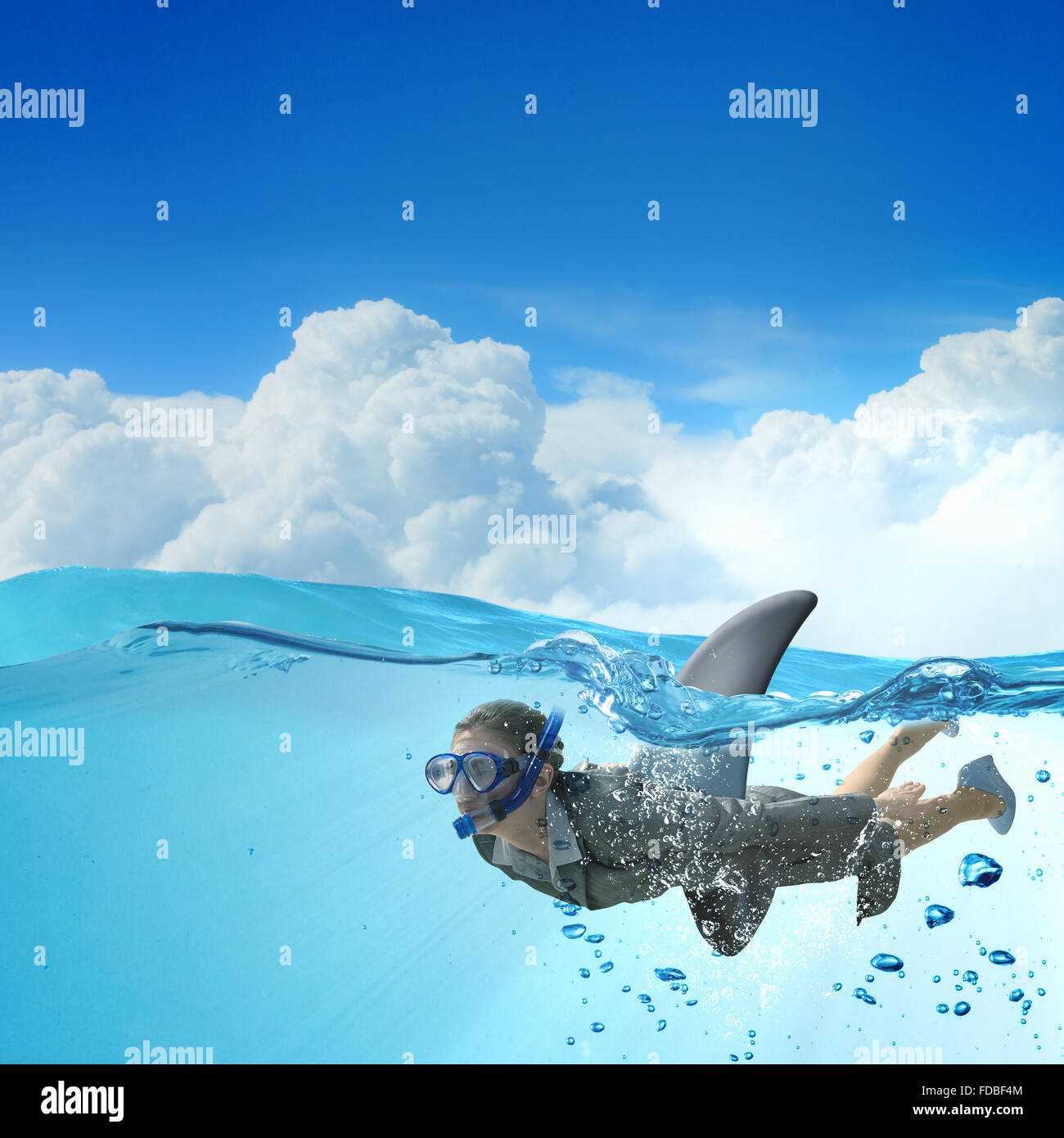 Young businesswoman with shark flipper swiming under water Stock Photo - Alamy