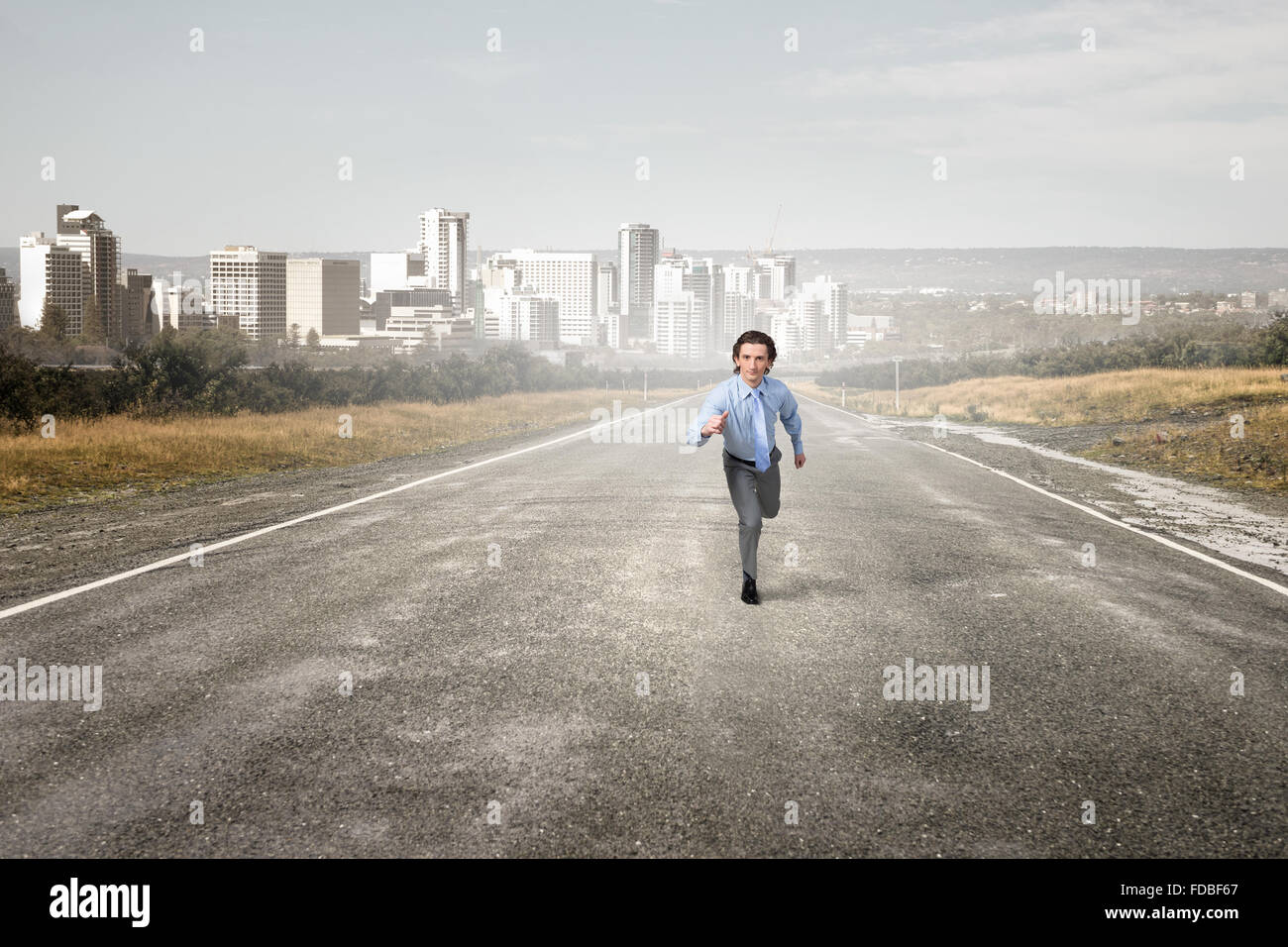Young guy running on asphalt hi-res stock photography and images - Alamy