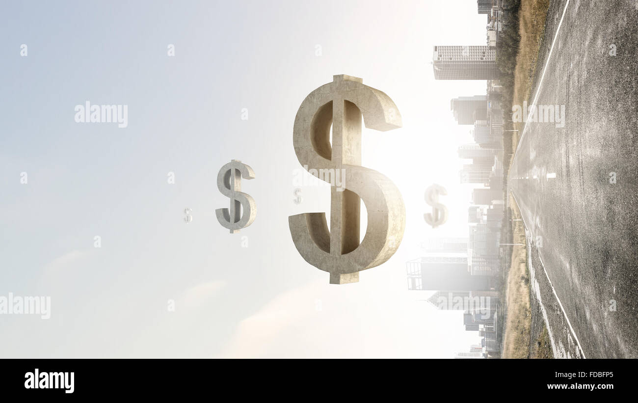 Big stone dollar currency sign on asphalt road Stock Photo - Alamy