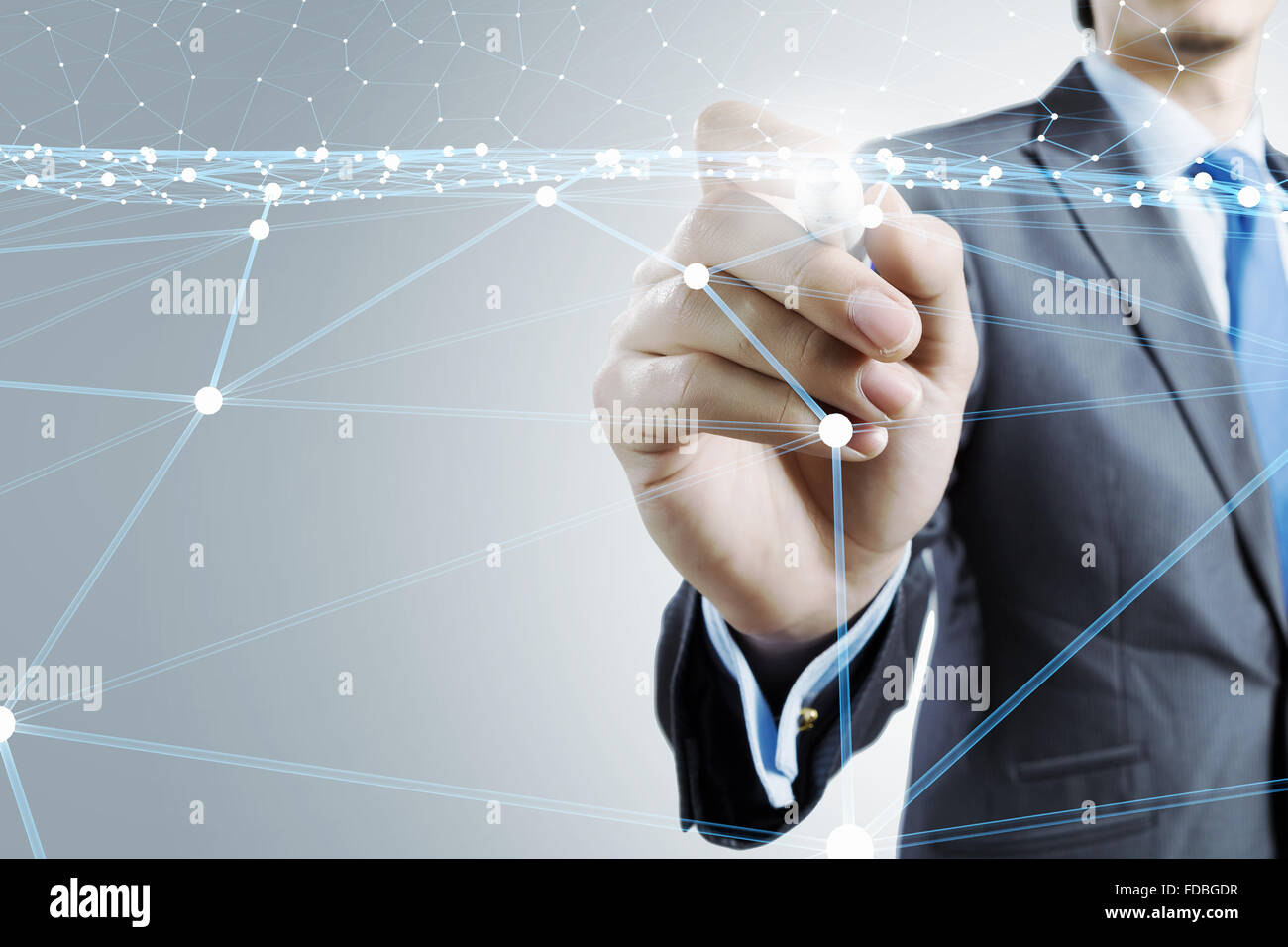 Businessman hand drawing digital connection lines on virtual screen ...