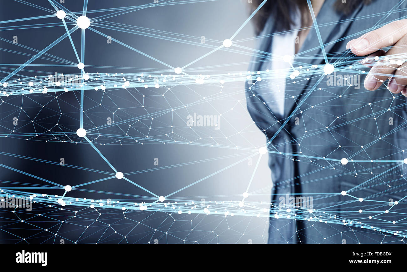 Businesswoman hand drawing digital connection lines on virtual screen ...