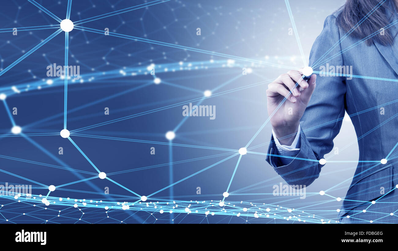 Businesswoman hand drawing digital connection lines on virtual screen ...