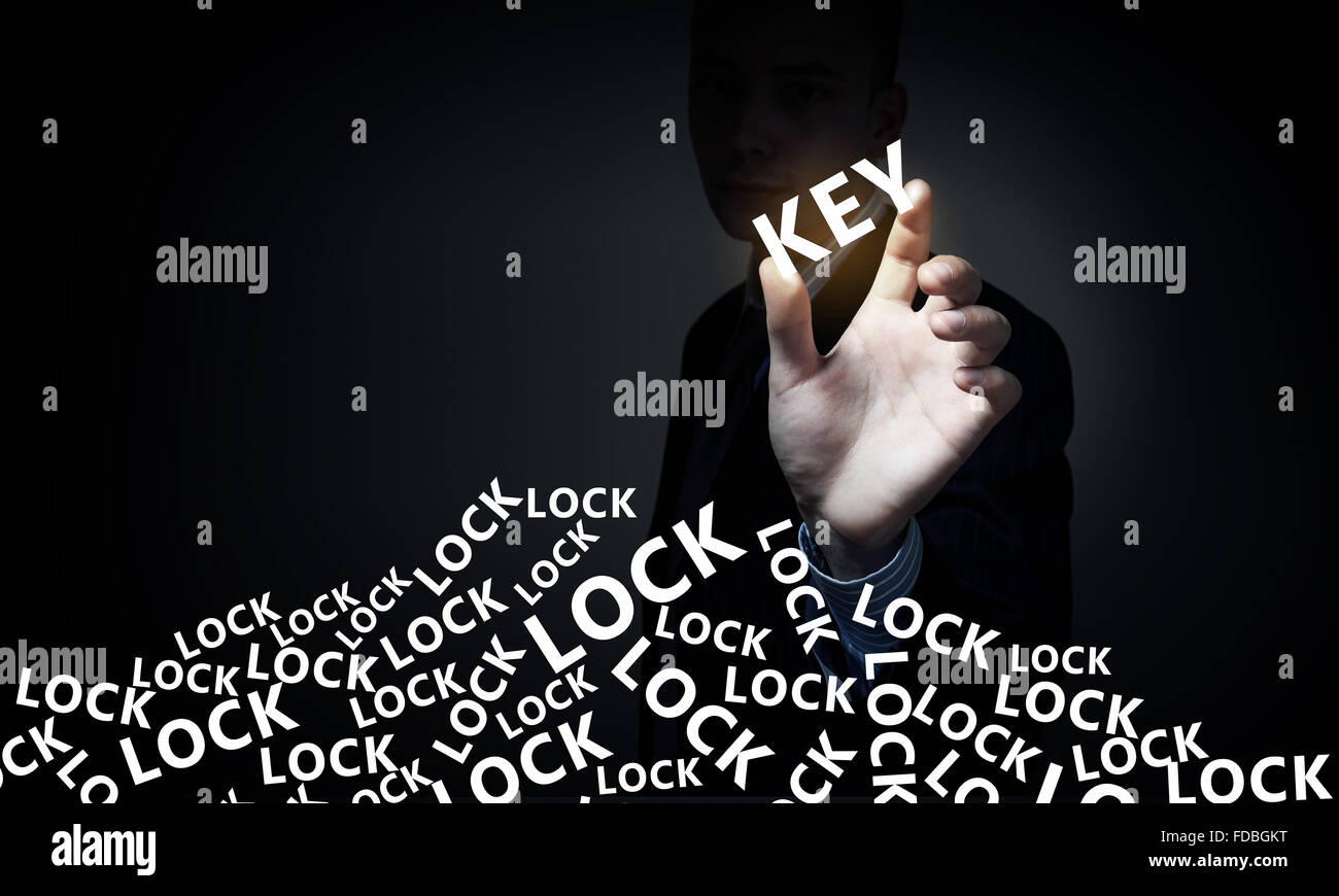 Male hand taking key glowing word with fingers Stock Photo - Alamy
