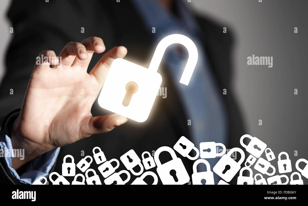 Female hand taking glowing lock with fingers Stock Photo - Alamy