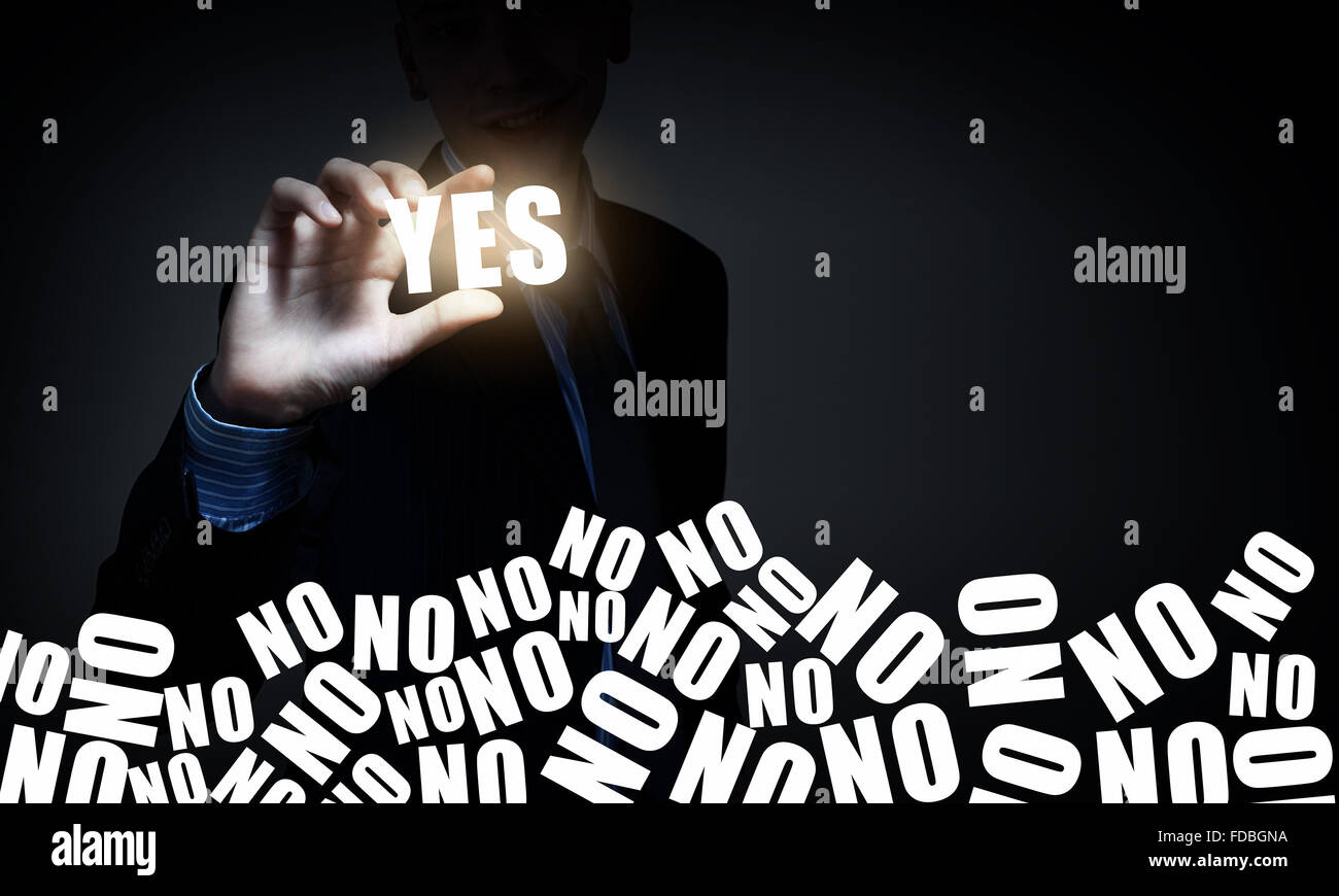 Hand of businessman taking word yes with fingers Stock Photo - Alamy