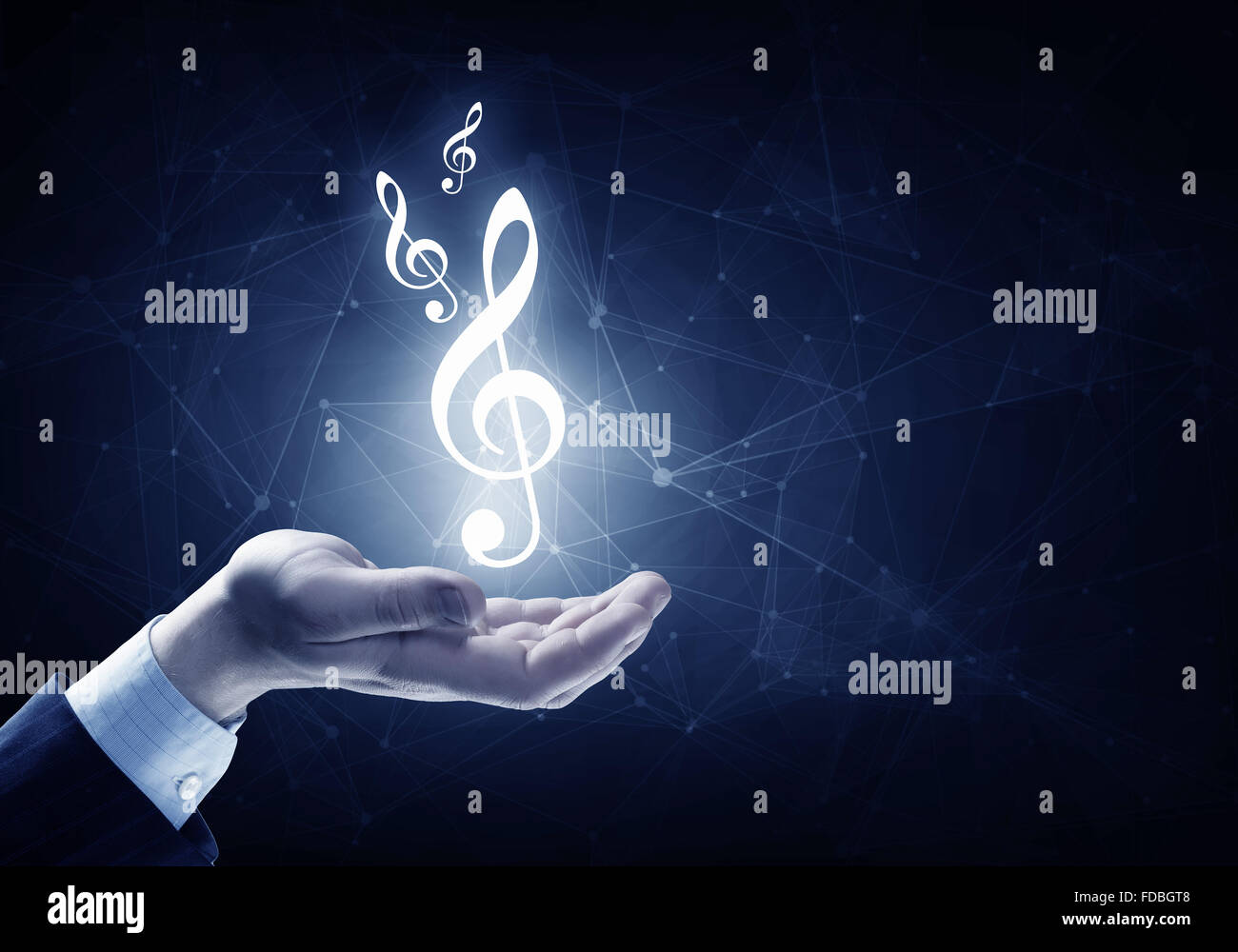 Close up of hand holding music icon in palm Stock Photo - Alamy