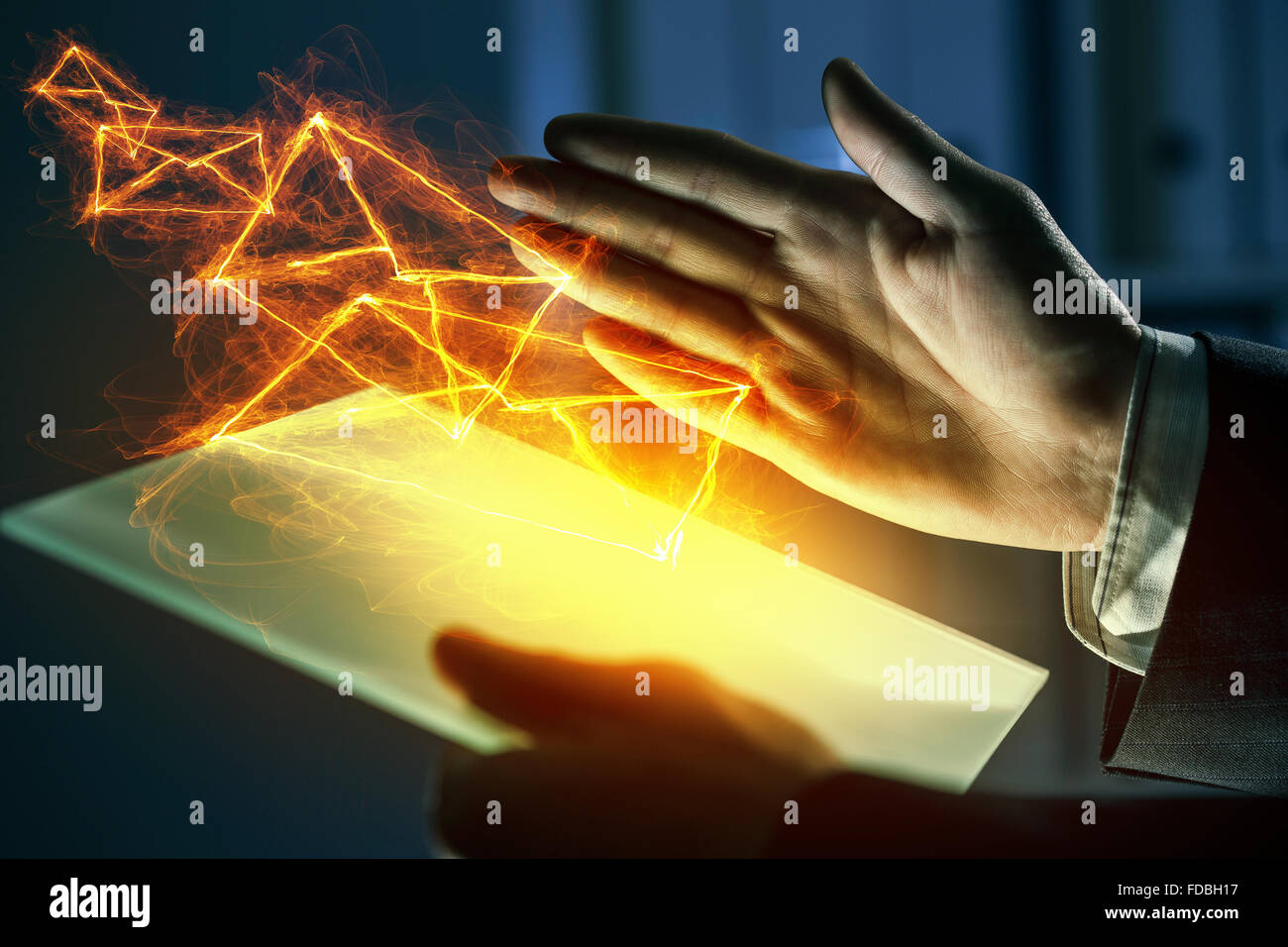 Glowing light email symbol on dark background Stock Photo - Alamy