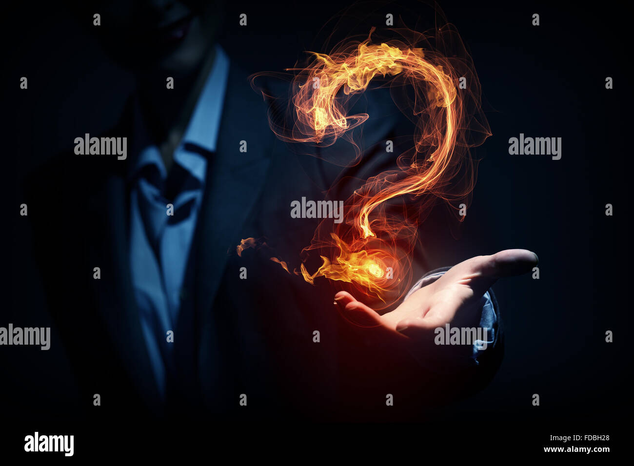 Glowing question mark symbol in palm on dark background Stock Photo - Alamy
