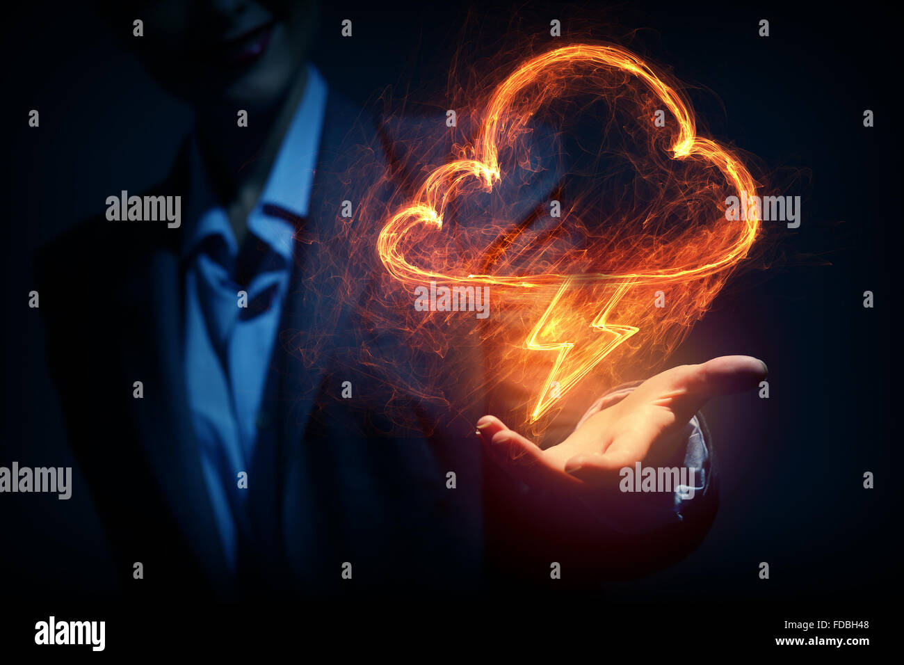 Glowing power lightning icon in palm on dark background Stock Photo - Alamy