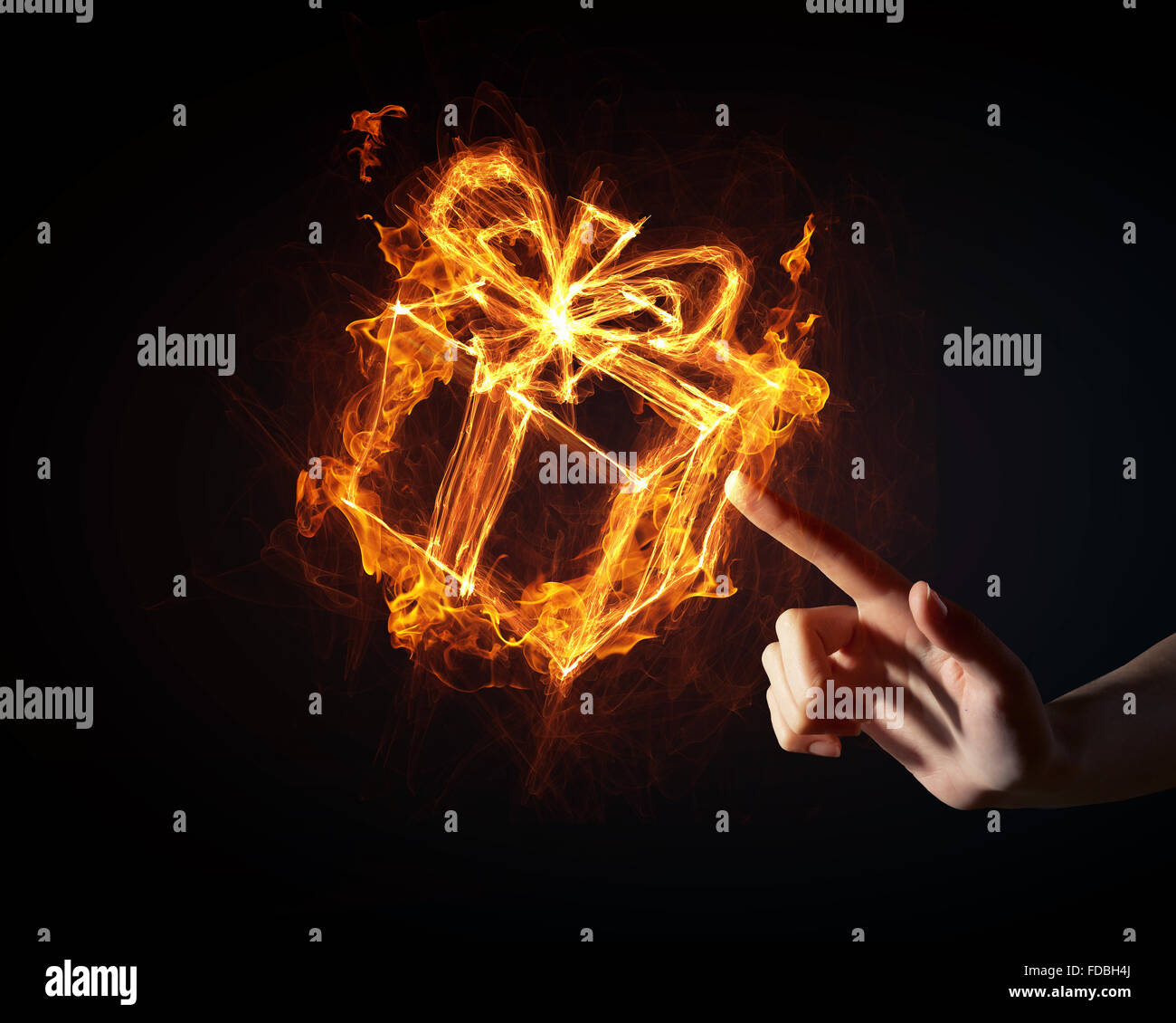 Glowing fire gift box icon on dark background Stock Photo - Alamy