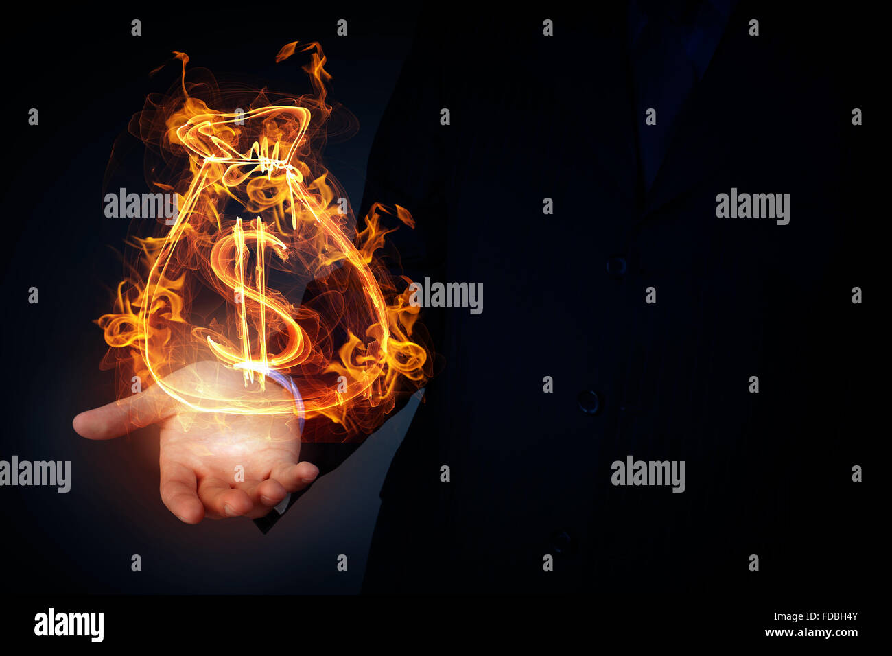 Burning dollar sign in businessman palm on dark background Stock Photo ...