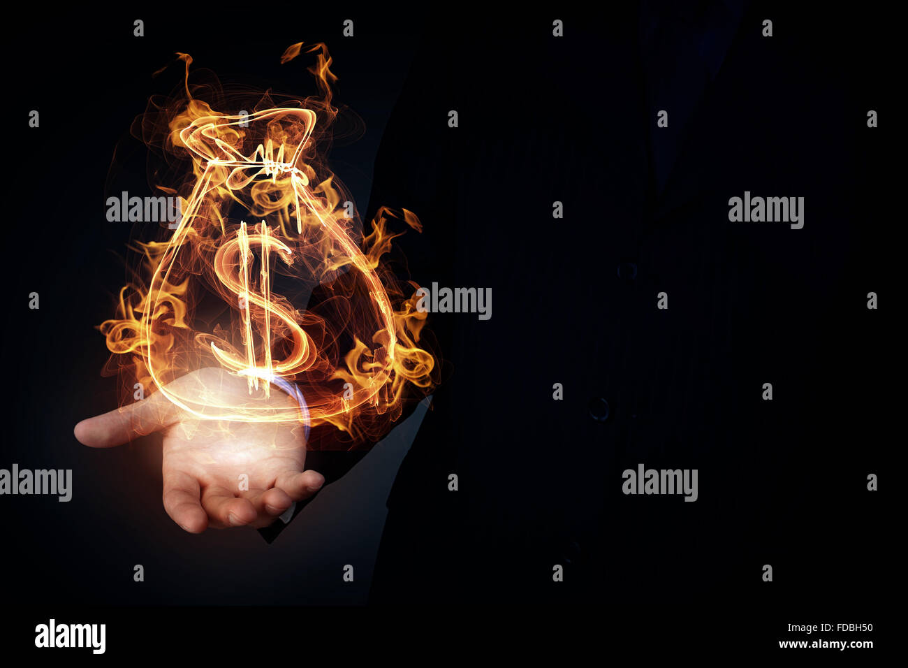 Burning dollar sign in businessman palm on dark background Stock Photo ...