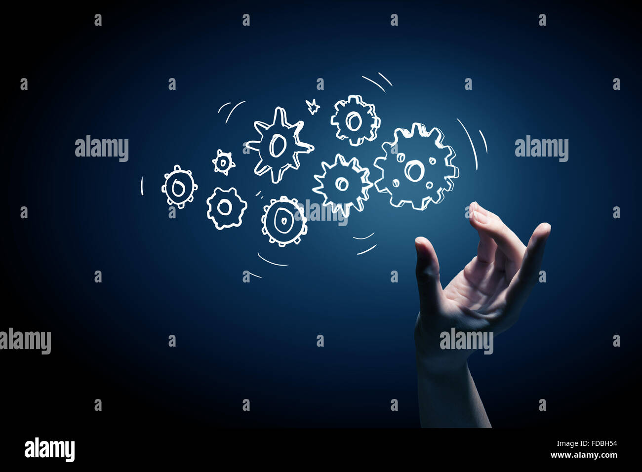 Business person hand touching gear mechanism representing interaction ...