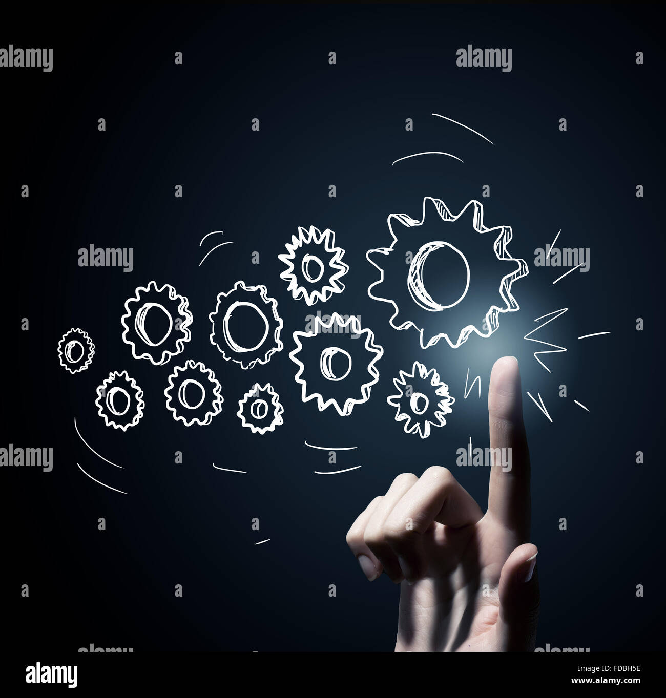Business person hand touching gear mechanism representing interaction ...