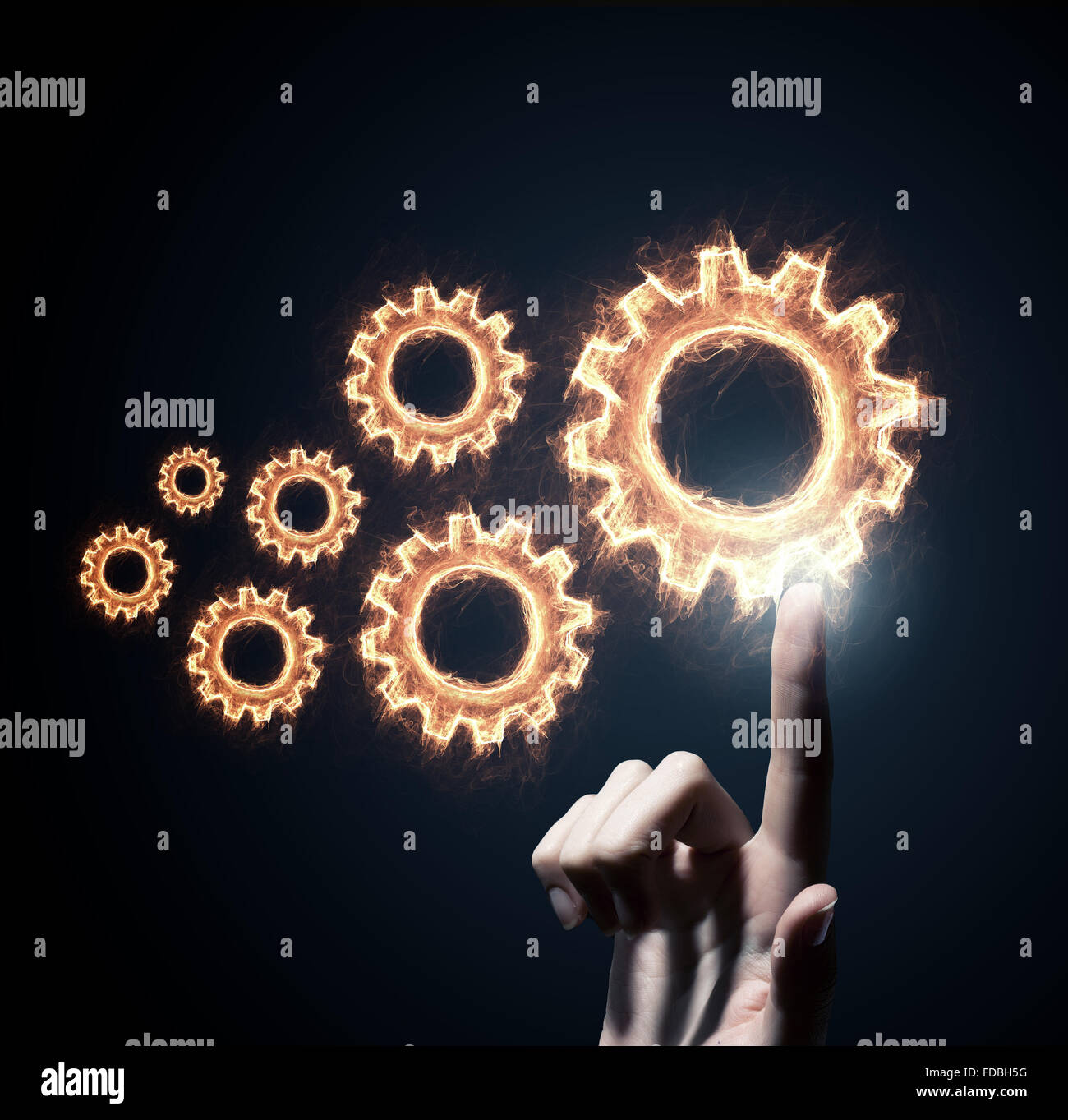 Business person hand touching gear mechanism representing interaction ...