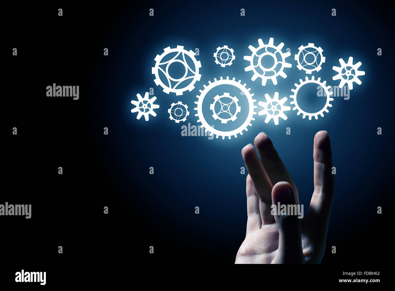 Business person hand touching gear mechanism representing interaction ...