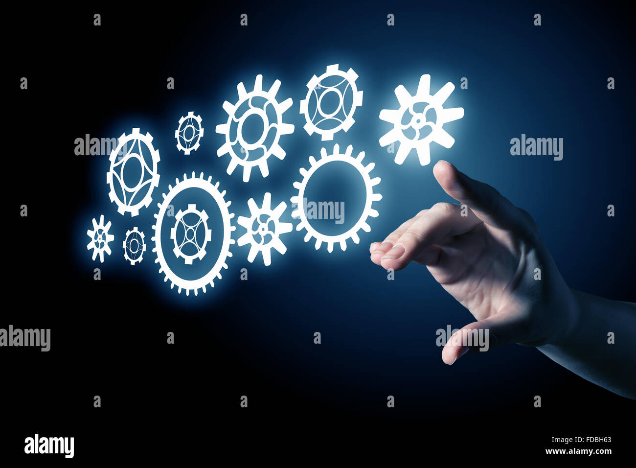 Business person hand touching gear mechanism representing interaction ...
