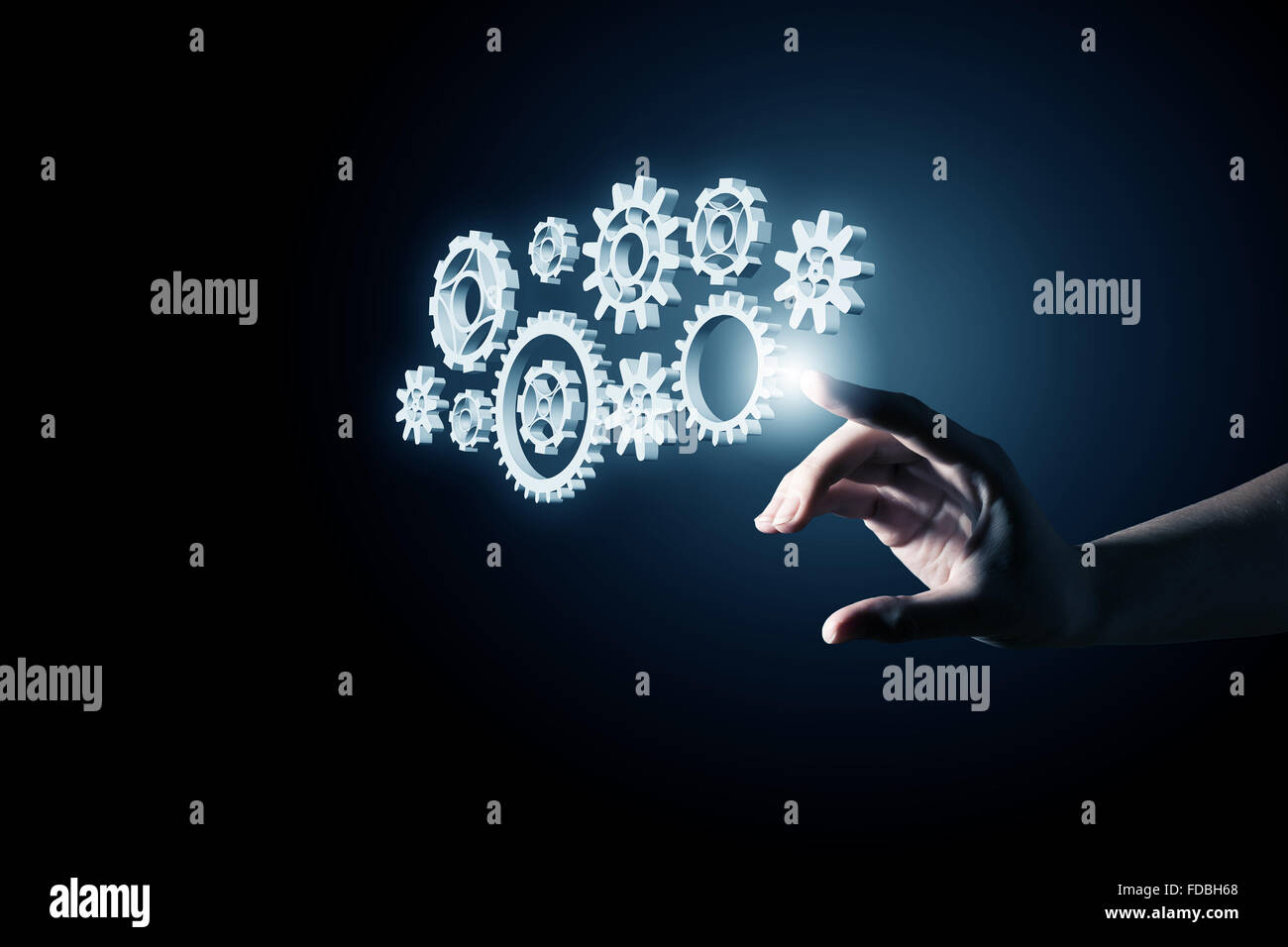 Business person hand touching gear mechanism representing interaction ...
