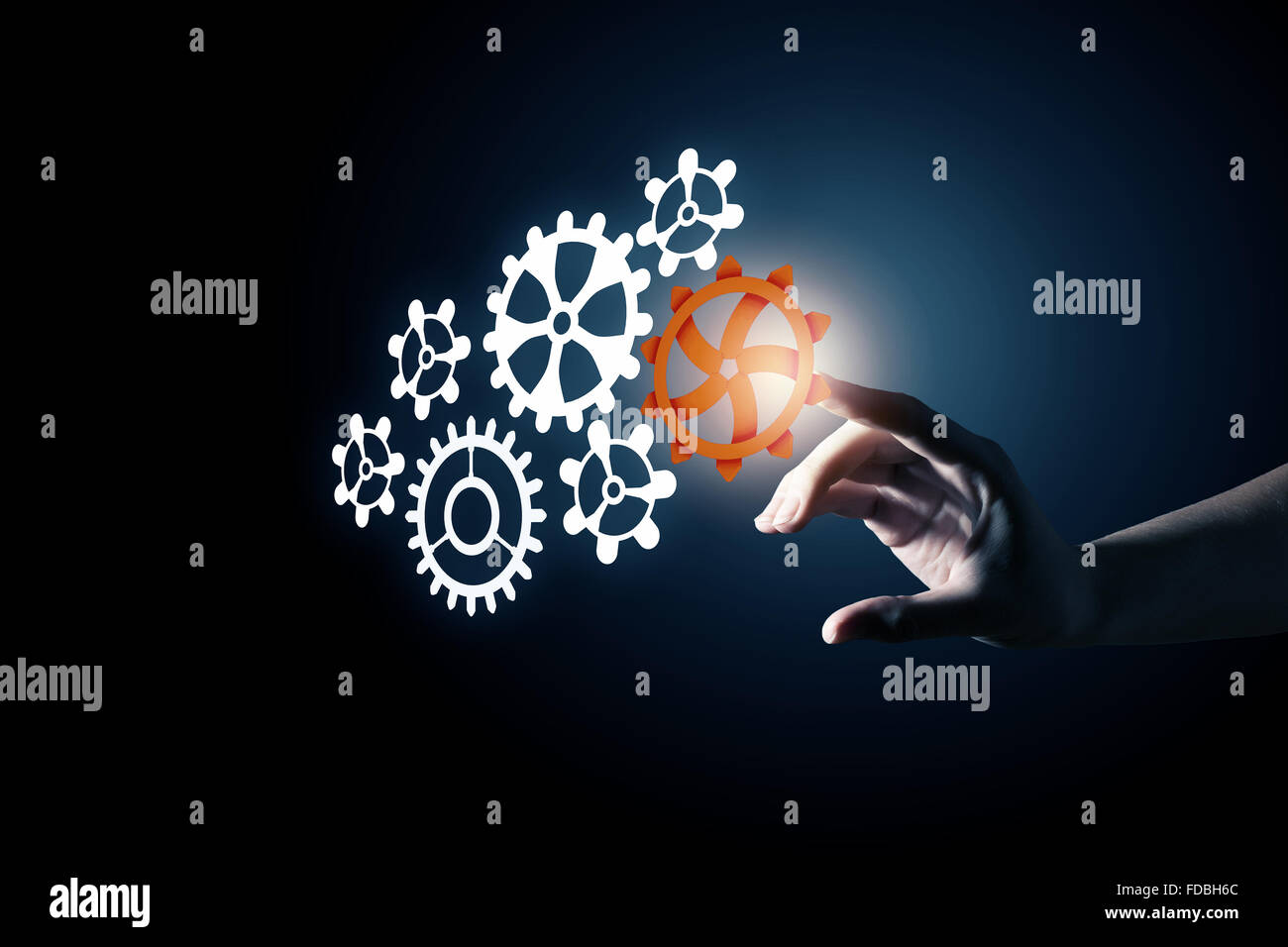 Business person hand touching gear mechanism representing interaction ...