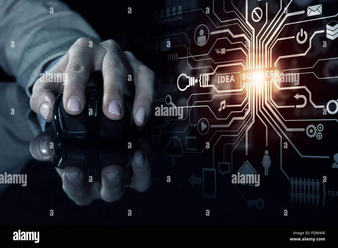 Hand of businessman in suit on dark digital background using wireless ...