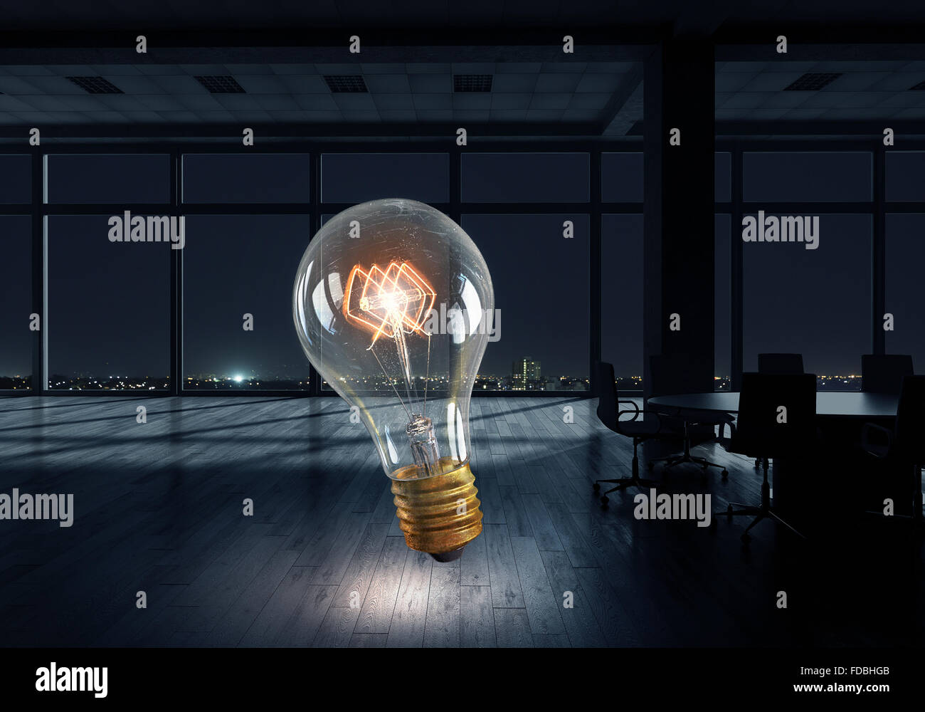 Glass light bulb against room with large window looking on city Stock ...